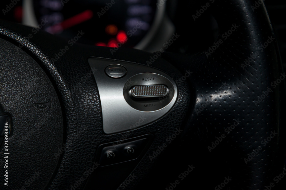 The shift lever to set the automatic cruise control speed inside the ...