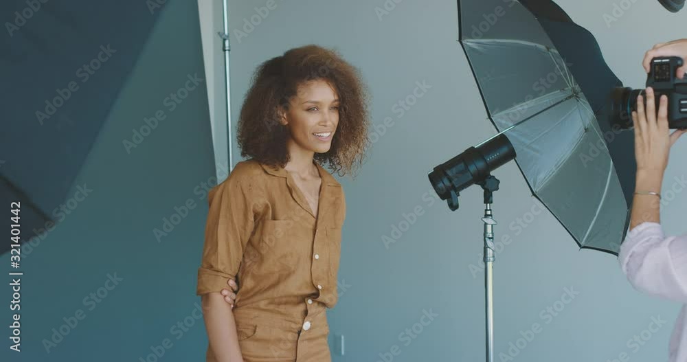 Beautiful african american woman modeling for a fashion photographer ...