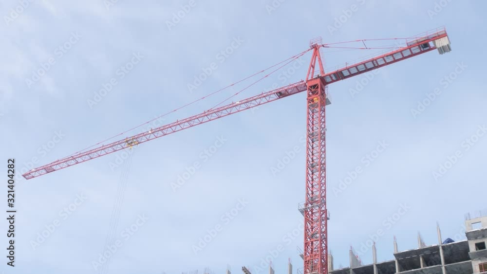 jib-type slewing crane with arrow mounted on vertically located tower ...