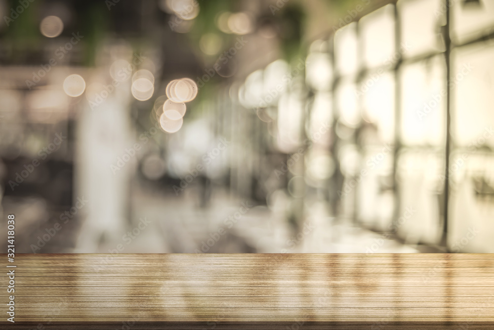 Wooden top table with bokeh light effect and blur beverage bar on ...