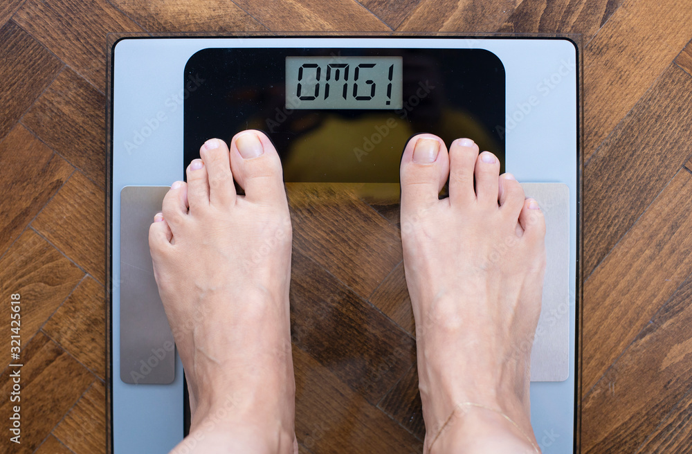 Female feet on weight scale Stock Photo | Adobe Stock