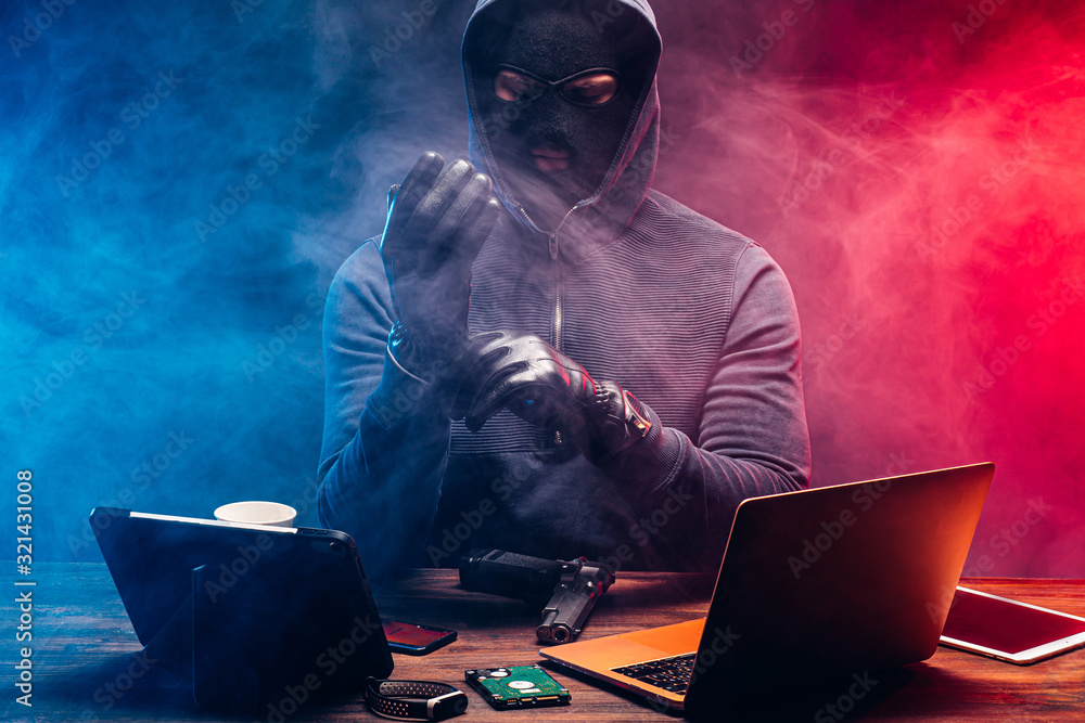 young programming expert hacker going to hack computer system, find password from bank account ...