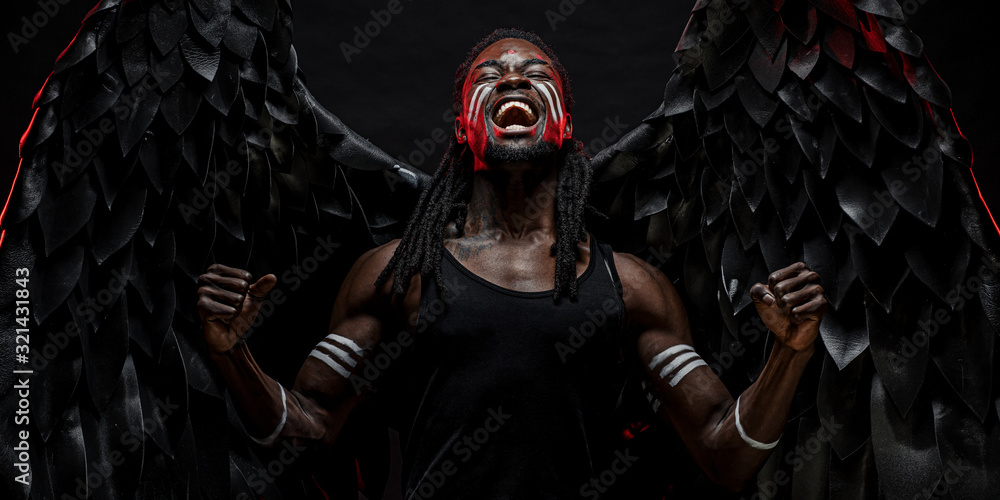 young african man in the image of an angel with big magnificent wings ...