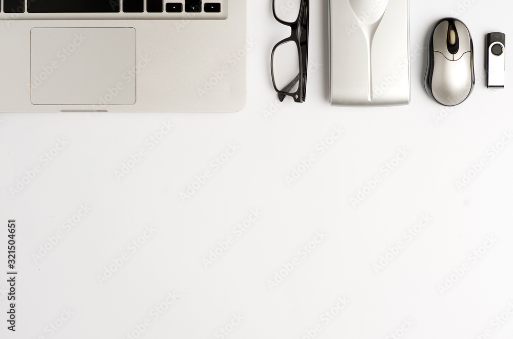 Office desk or executive desk with laptop, blank sheet book, goggles ...