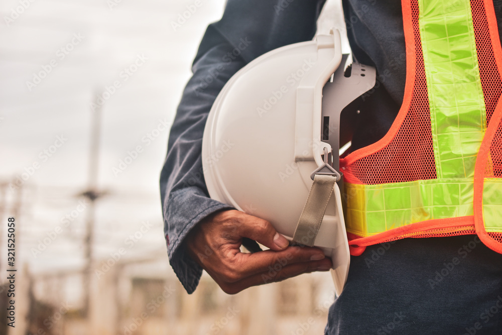 Engineer holding white helmet safety hard hat copy spec Stock Photo ...