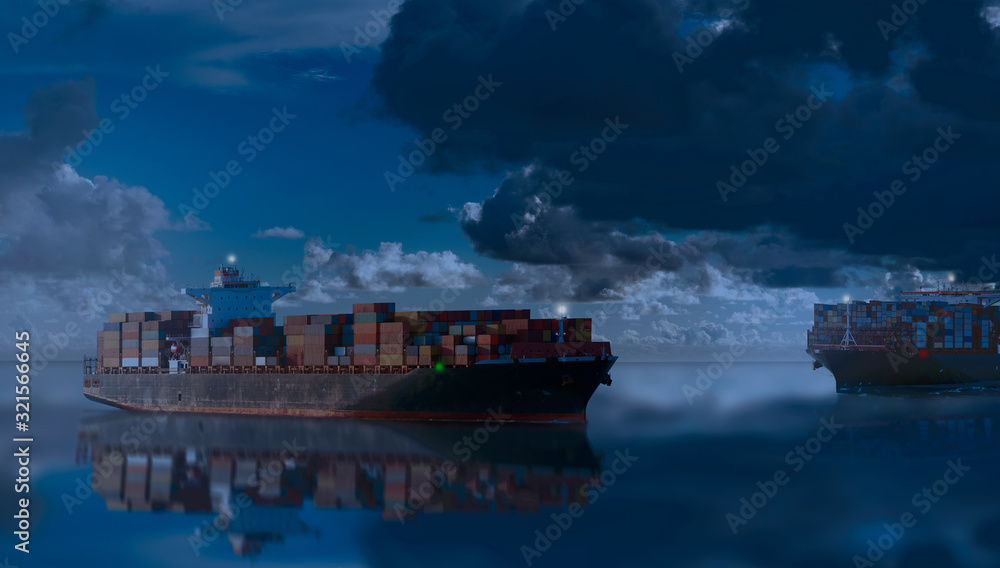 Mighty container ships in ocean at night underway performing import and export marine cargo ...