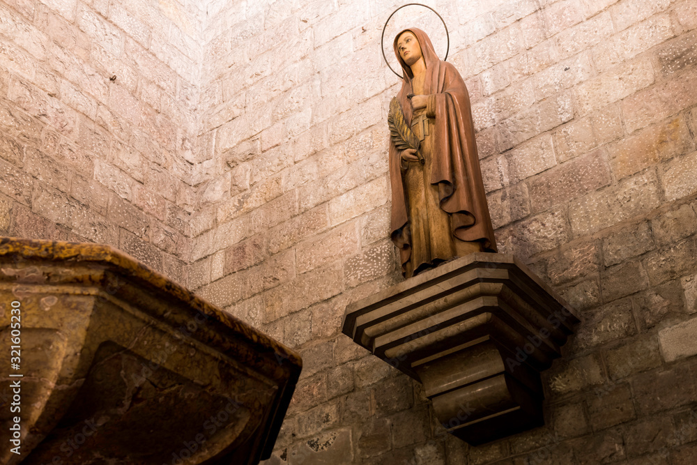 Stone statue of a virgin inside a Catholic church Stock Photo | Adobe Stock