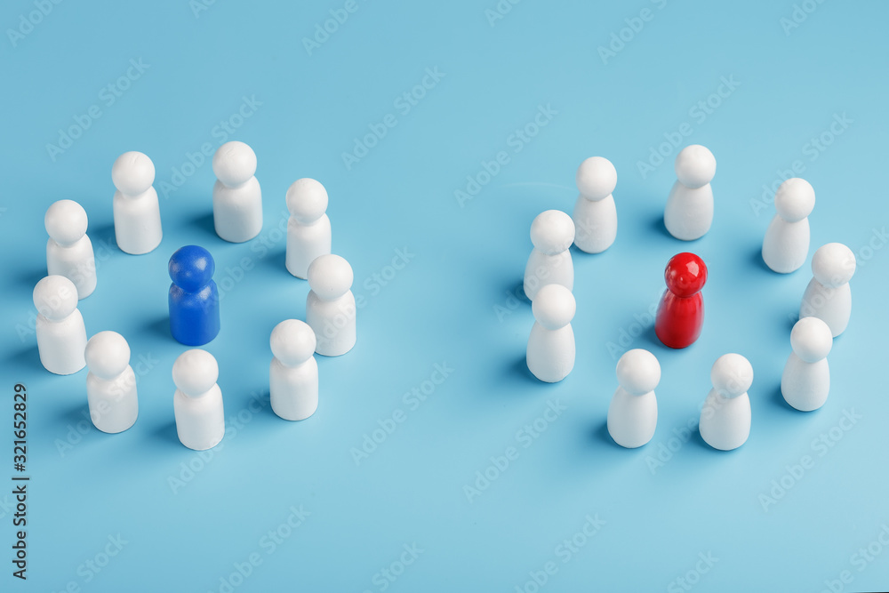 Two different Groups of white people stand around the blue and red ...