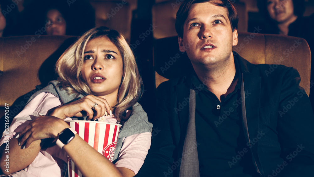 People audience watching movie in the movie theater cinema. Group ...