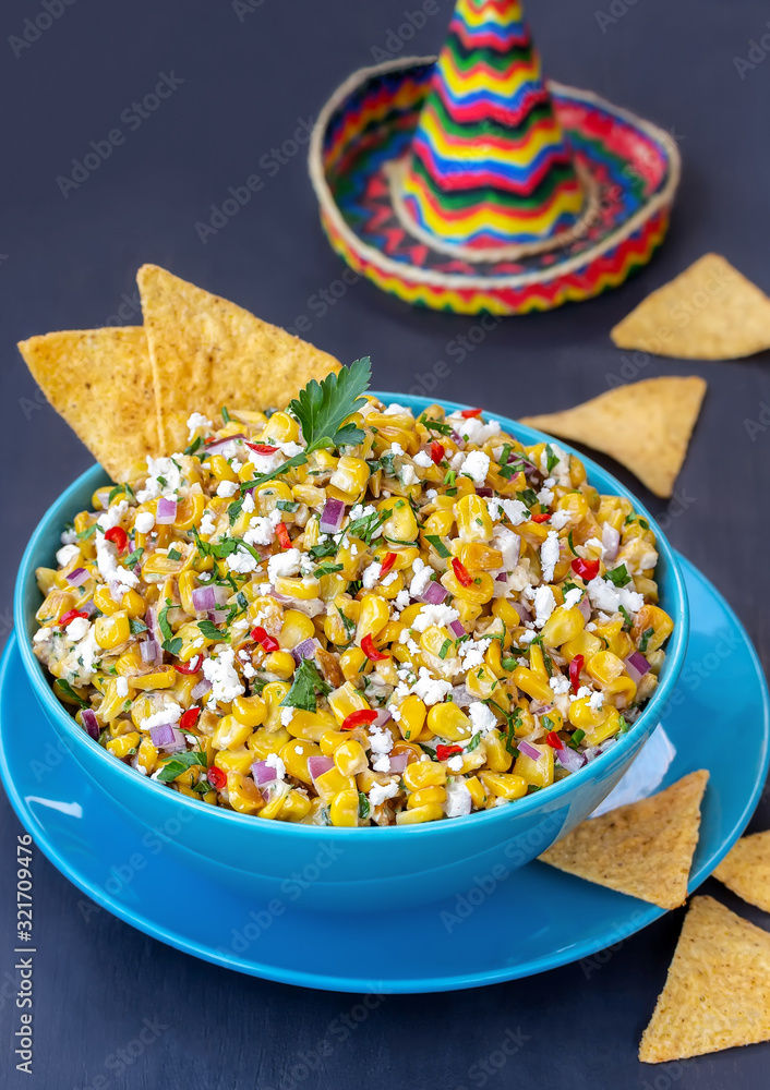 Mexican corn appetizer Elote. Roasted street corn salad or dip with ...