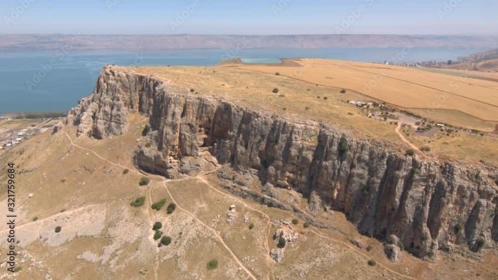 The beautiful Mount Arbel by the blue Sea of Galilee on a bright ...
