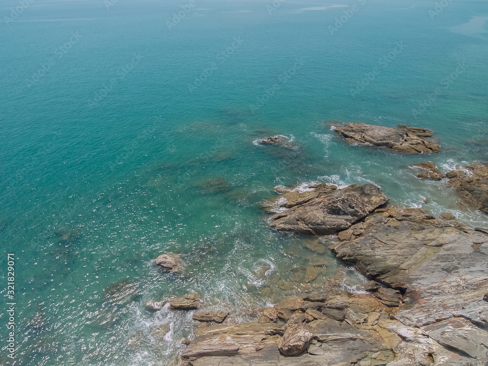 Top view of many rocks in blue-green sea background, Laem Tanod (Tanod ...