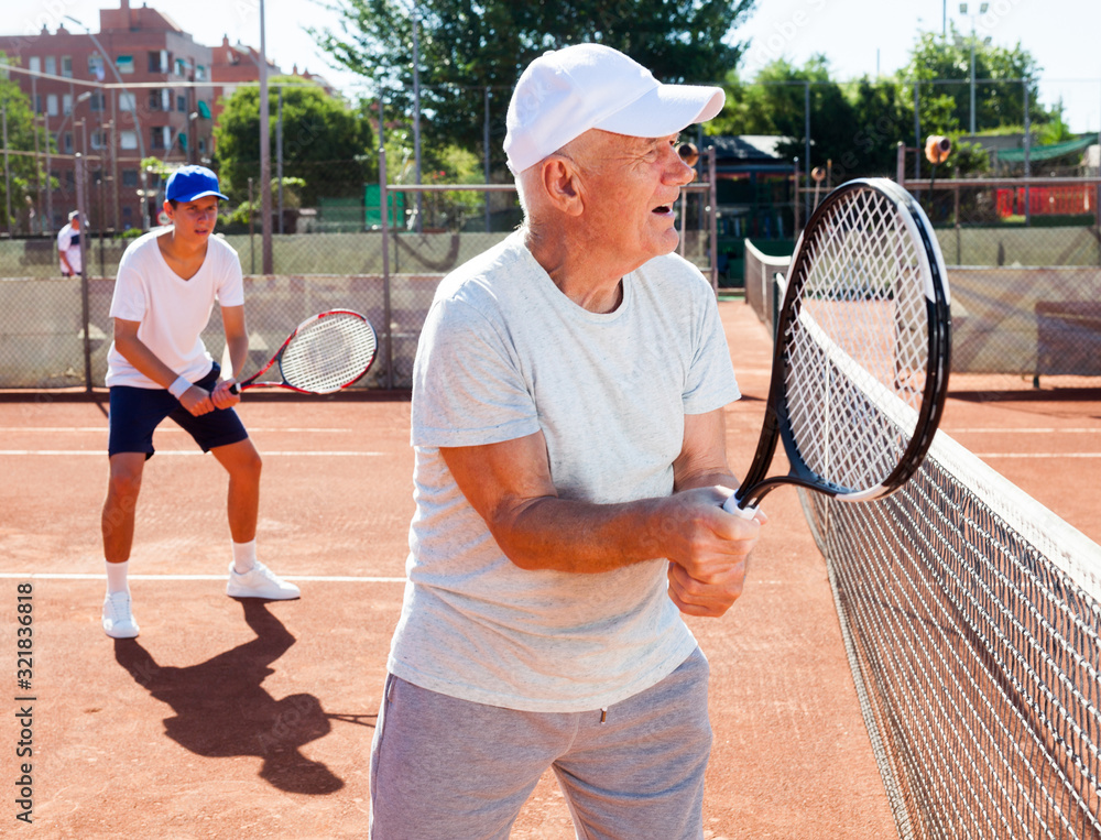 tennis players of different generations playing tennis court Stock ...