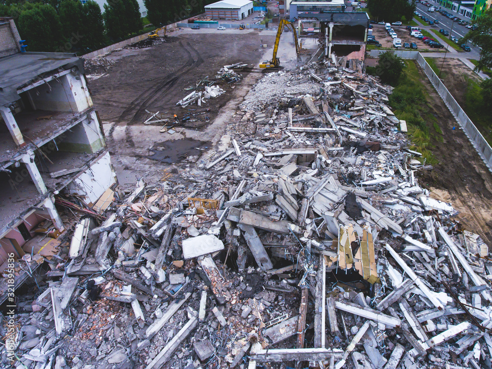 A process of buliding demolition, demolition site with heavy bulldozer ...