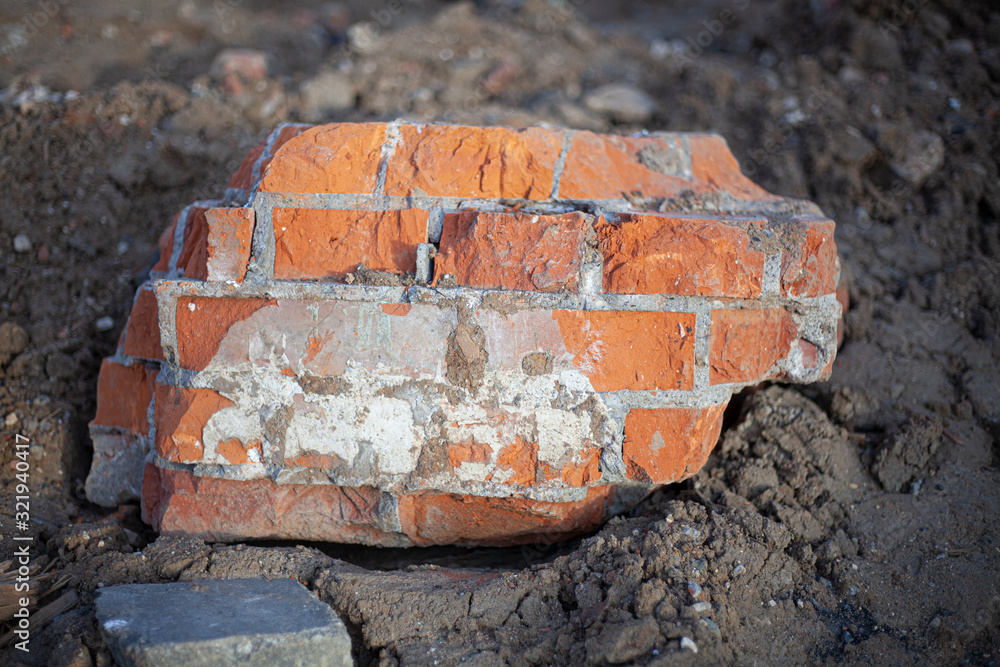 Brick wall. The ruin house. The destroyed structure. A broken piece of ...