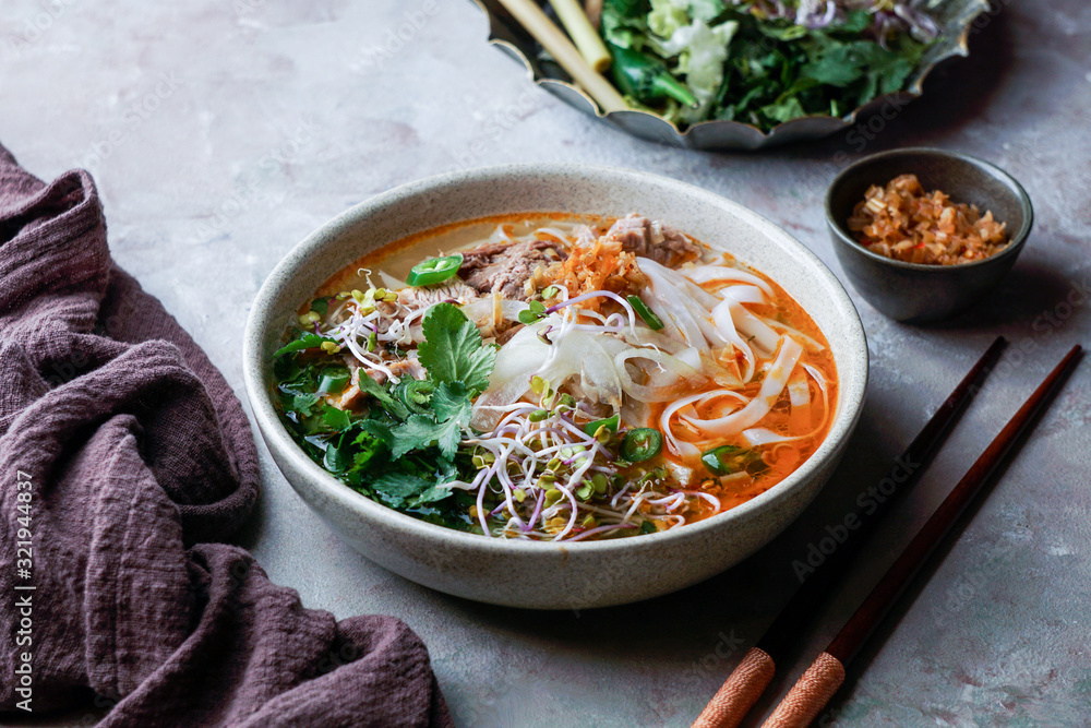 Bun Bo Hue, Bun Bo, Vietnamese beef noodle soup spicy. bowl of beef and ...