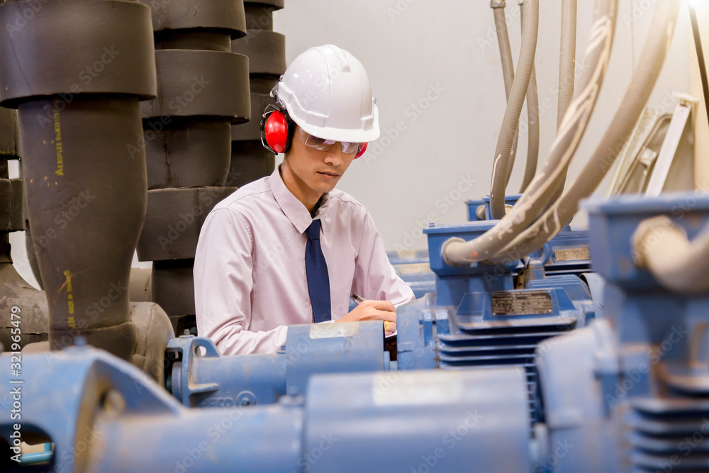 Engineer checking Condenser Water pump and pressure gauge , chiller ...