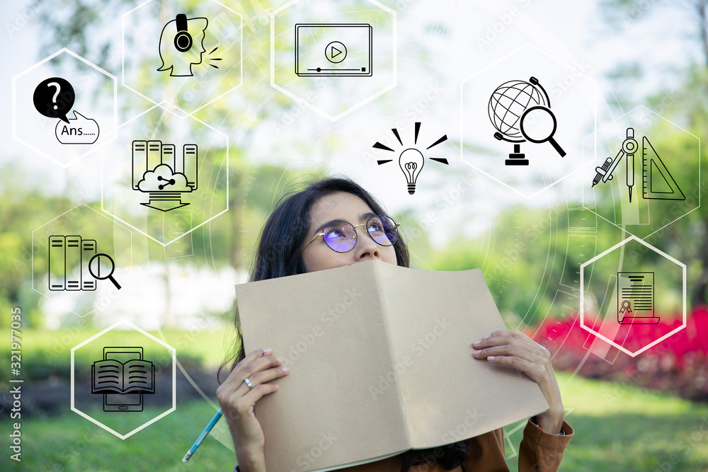 E-learning background a young Asia girl is thinking and learning ...