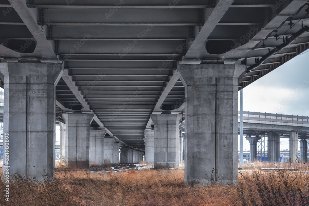 Highway overpass, under the viaduct. Views of the massive concrete ...