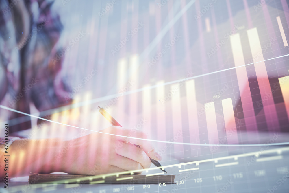 A woman hands writing information about stock market in notepad. Forex ...