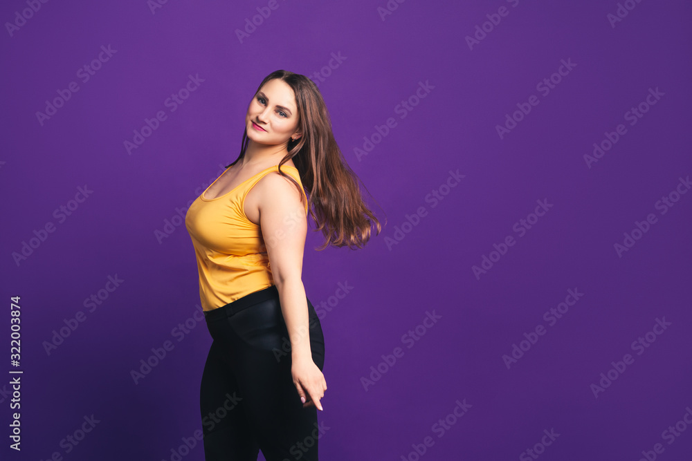 Plus size fashion model in casual clothes, fat woman on purple ...