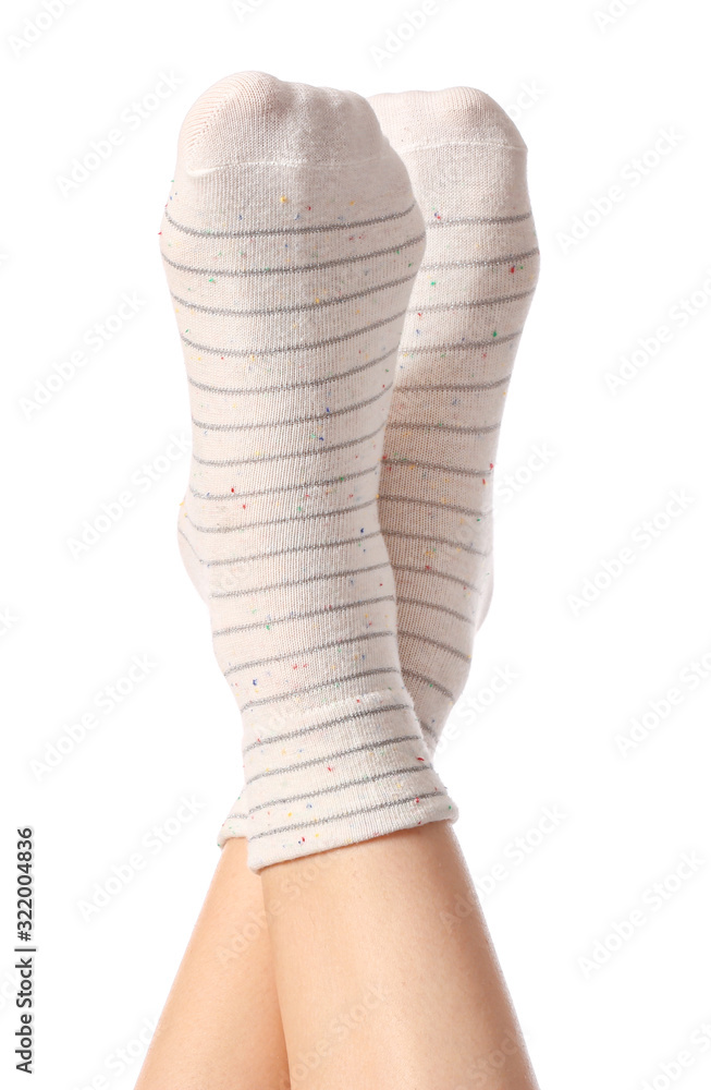 Legs of young woman in socks on white background Stock Photo | Adobe Stock