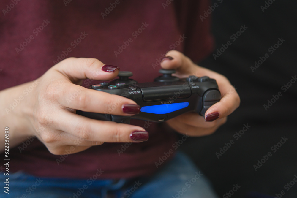 Ukraine, Odessa - July 2, 2019: A girl plays a video game on a ...