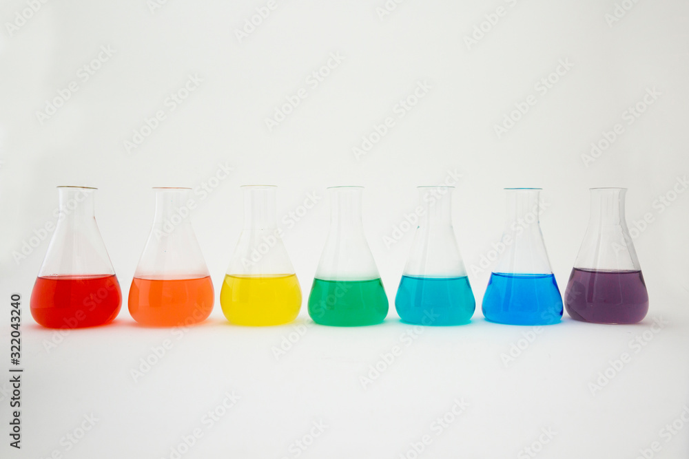 Scientific laboratory glass erlenmeyer flask filled with colorful ...