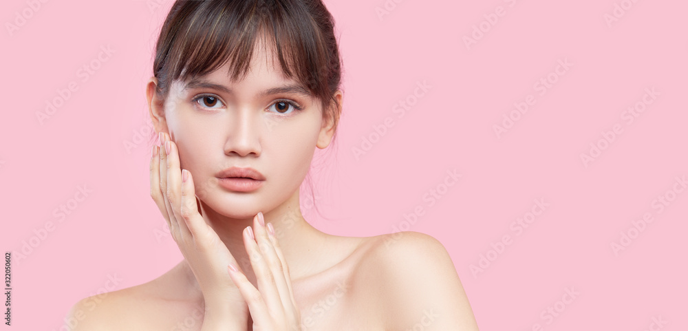 Beautiful young asian korean woman with clean fresh skin touching her ...