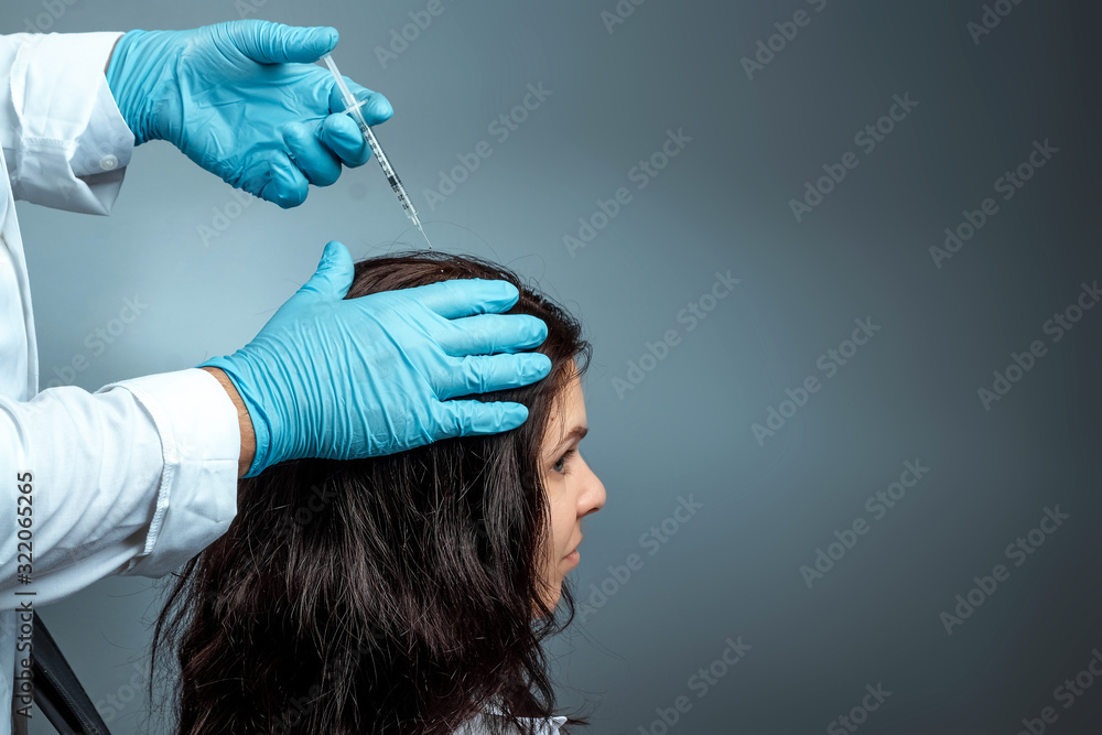 Injection for hair growth, Doctor Krupnypy Lan's hands make an ...