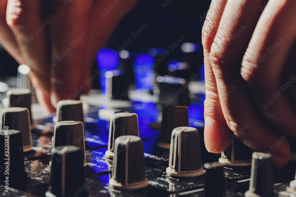 music, technology, people and equipment concept - man using mixing ...