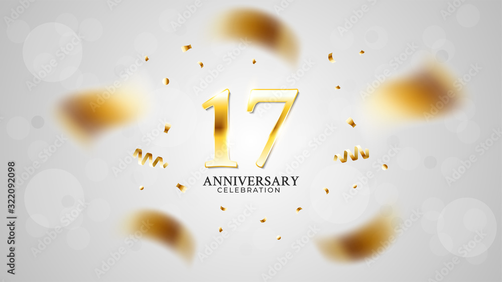 17th anniversary celebration with gold color and white background bokeh ...