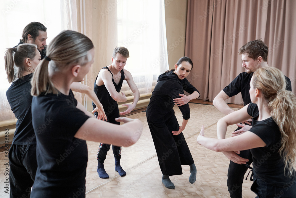 Professional contemporary dance team learning new moves in their ...
