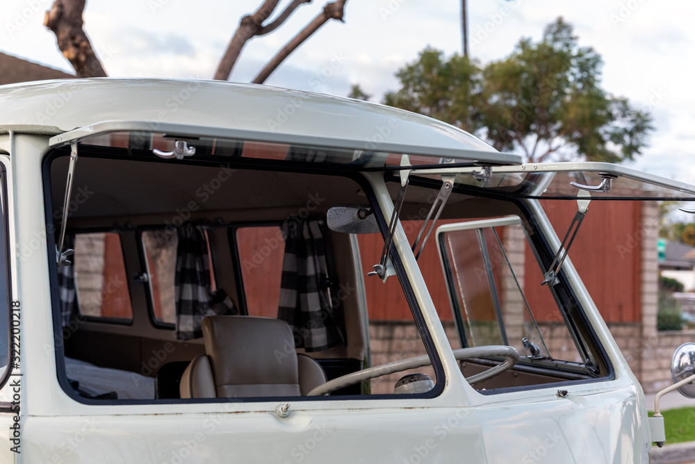 Classic vintage vehicle bus with fold up windshield that props open for ...