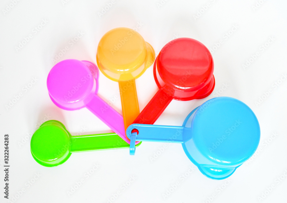 Top view colorful of plastic measuring spoons set in blue sky, red ...
