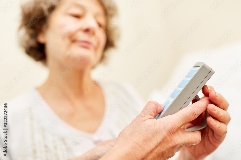 Nursing helps with the remote control Stock Photo | Adobe Stock