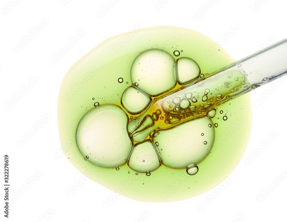Liquid gel or serum on a screen of microscope white isolated background ...