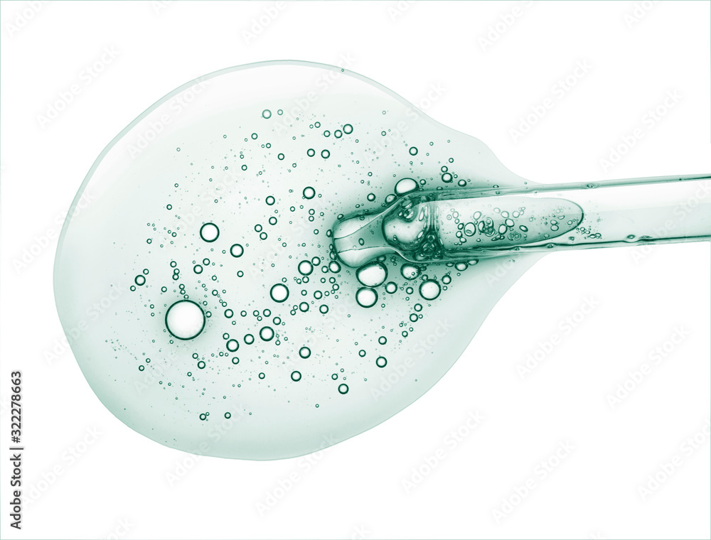 Liquid gel or serum on a screen of microscope white isolated background ...