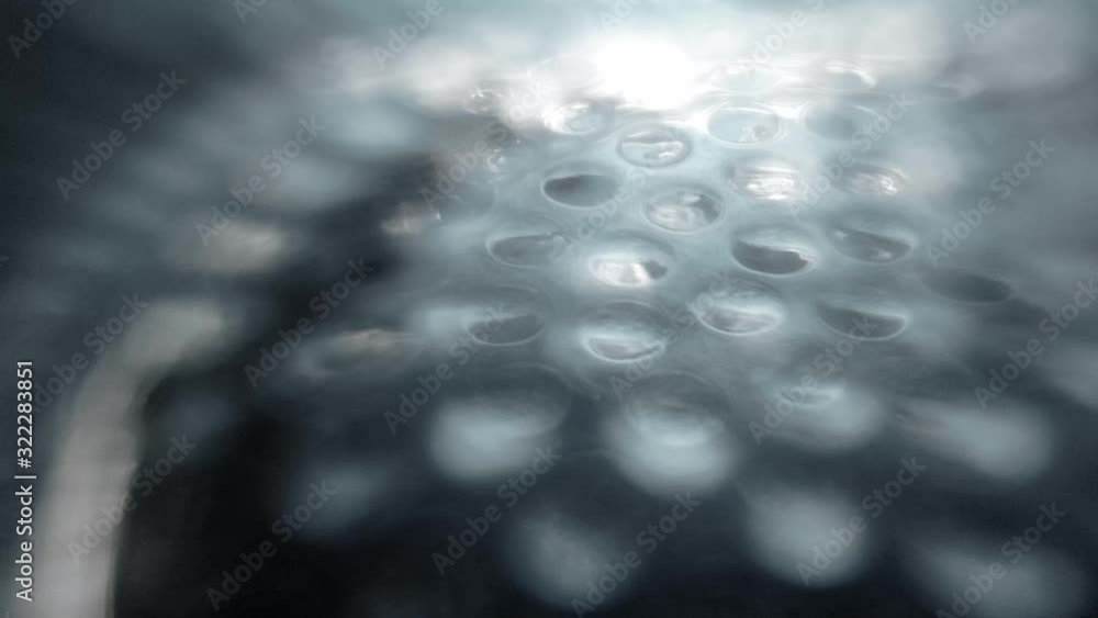 Beautiful glass bowl with bumpy texture and pattern lines magnifying ...