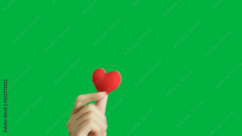 4K. woman hand showing red heart on isolated on chroma key green screen ...