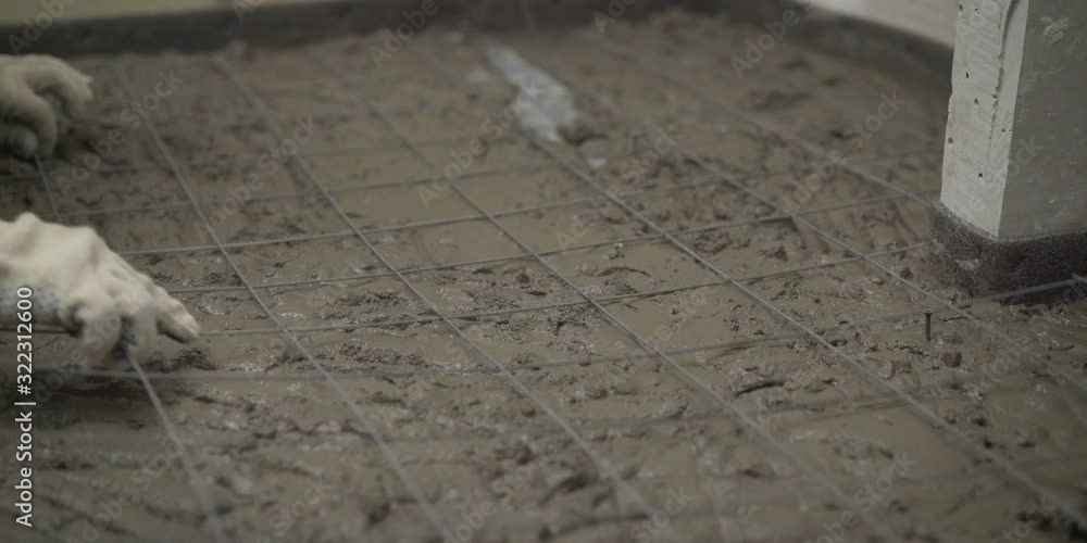 Close-up view of concrete reinforcement with metal rods connected by ...