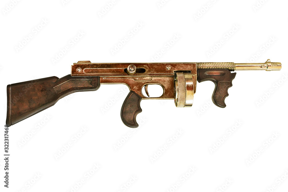 Vintage gold coloured machine gun isolated on white Stock Photo | Adobe ...