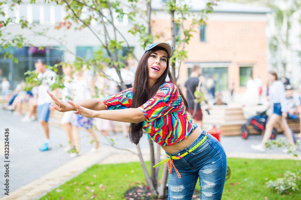 Street shaabi dance and urban dancer concept - Cheerful belly dancer ...