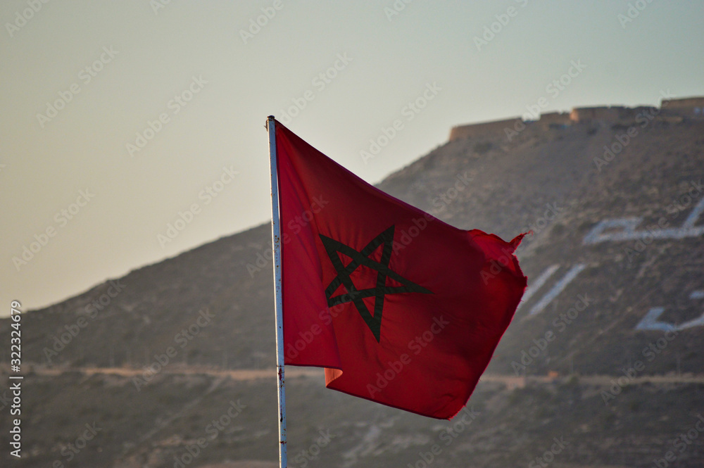 Moroccan red flag flying high at the beach in Agadir, Morocco Stock ...