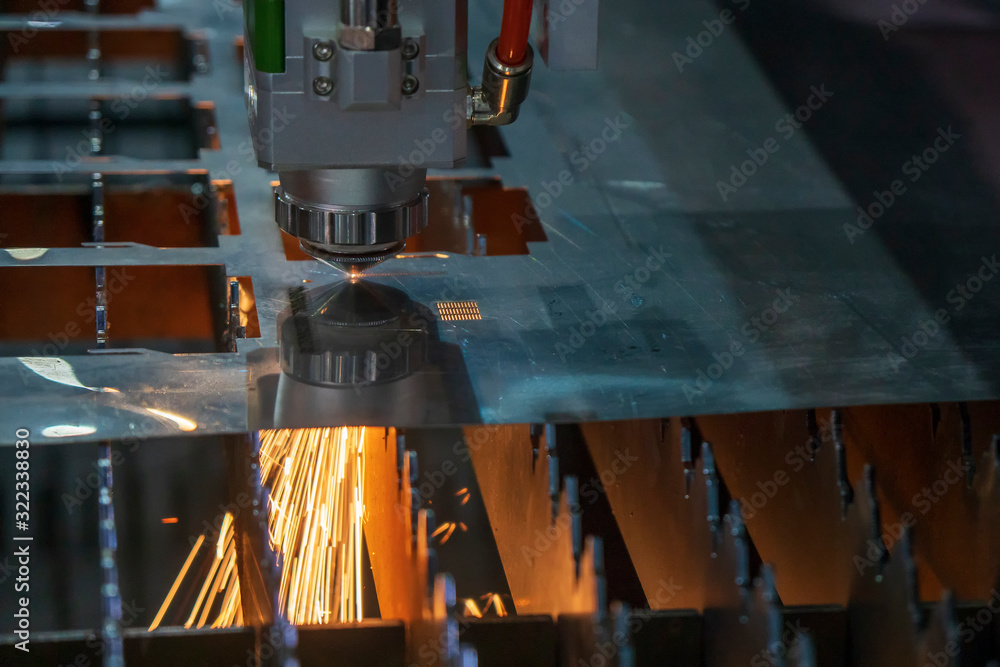 The close up scene of fiber laser cutting machine cutting the sheet ...