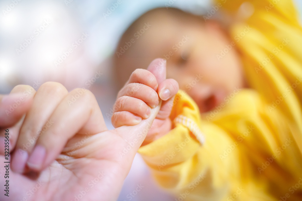Newborn baby touching his mother hand, Baby holding finger of his ...