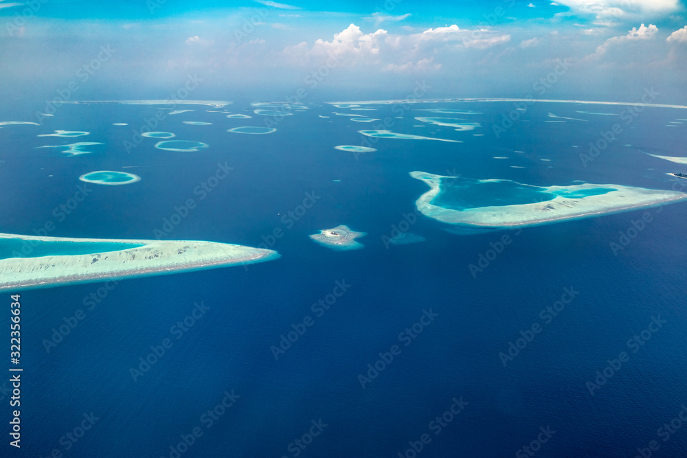 Amazing aerial of the beautiful atolls of the Maldives. Small tropical ...