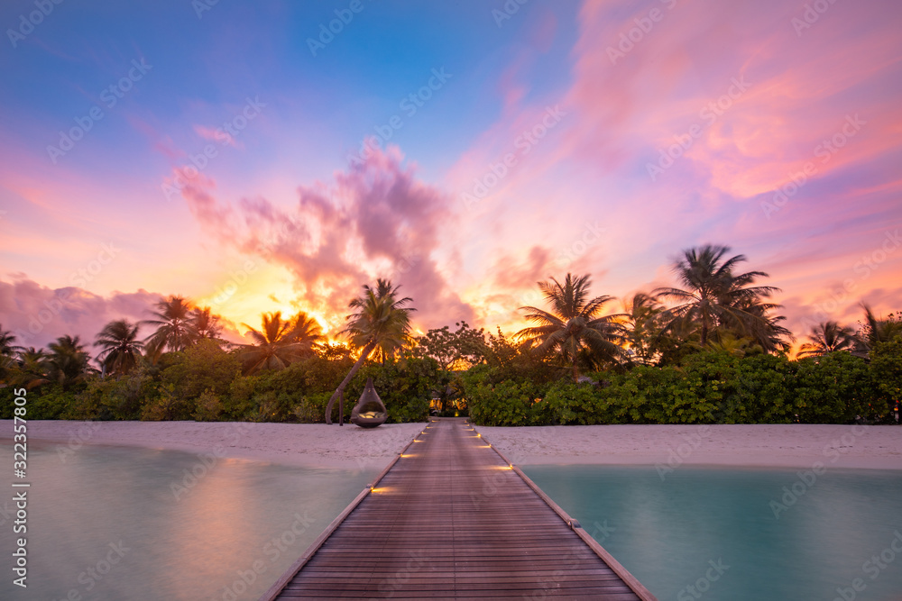 Sunset on Maldives island, luxury water villas resort and wooden pier ...