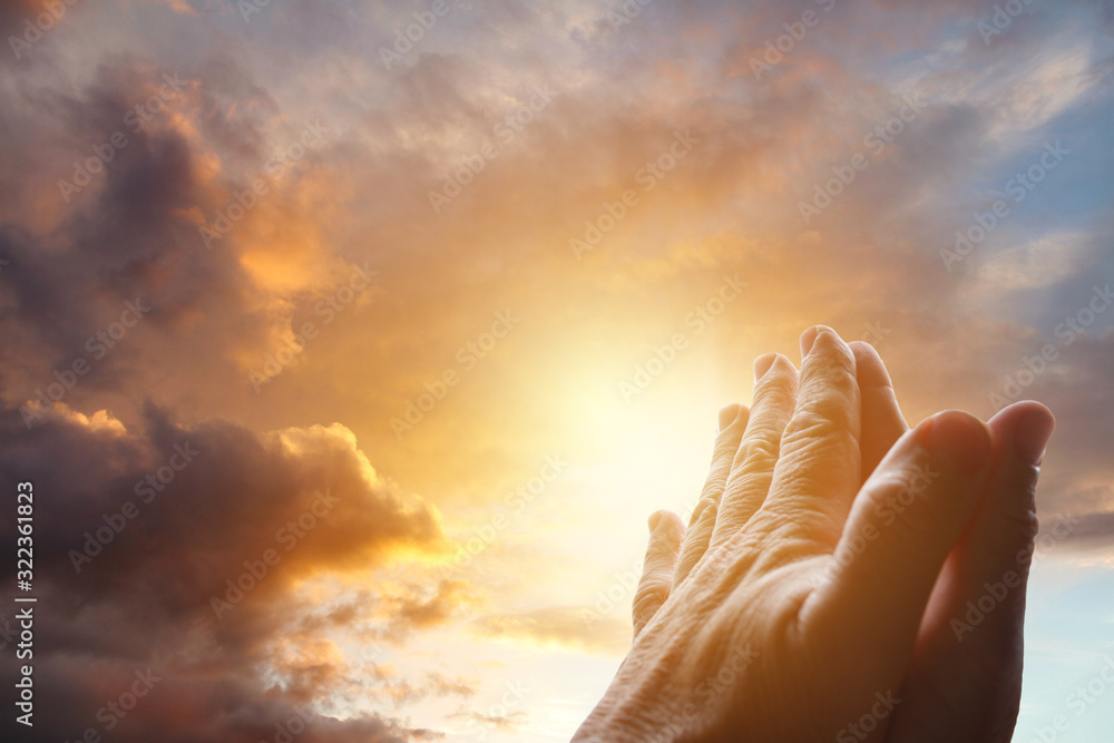Prayer hands in sky Stock Photo | Adobe Stock
