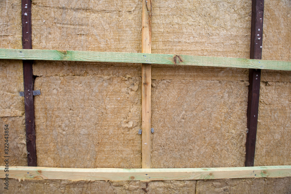 warming the walls of a stone house with a stone wool heater. Ecological ...